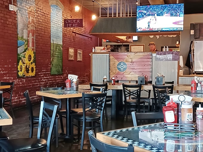 Exposed brick, sunflower murals, and that unmistakable aroma of slow-smoked meat—this isn't just a restaurant, it's a Kansas love letter.