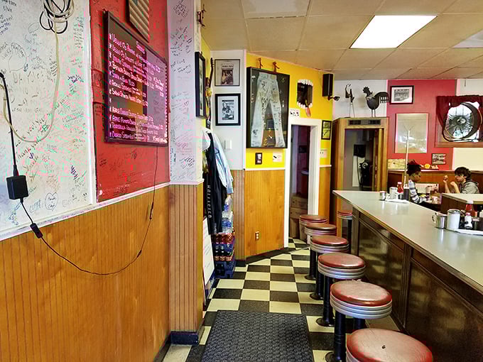 Classic black-and-white checkered floors lead to retro counter seating where breakfast dreams come true. The walls tell stories of countless satisfied customers who've found their morning bliss.