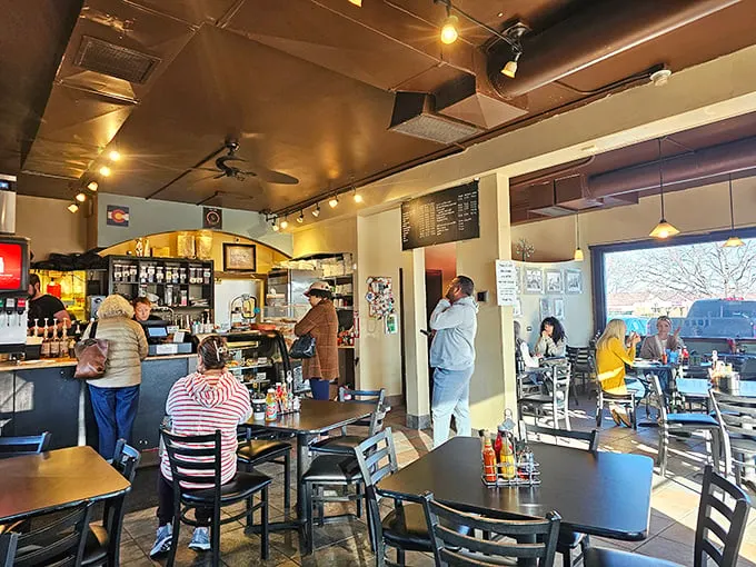 Morning light streams through windows as locals gather at this cozy café—proof that Coloradans know breakfast isn't just a meal, it's a celebration.