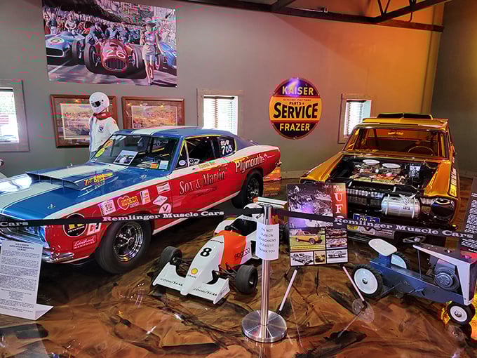 Racing dreams come alive with this red and blue Plymouth drag racer. The orange beast beside it isn't just a car—it's a four-wheeled adrenaline delivery system.