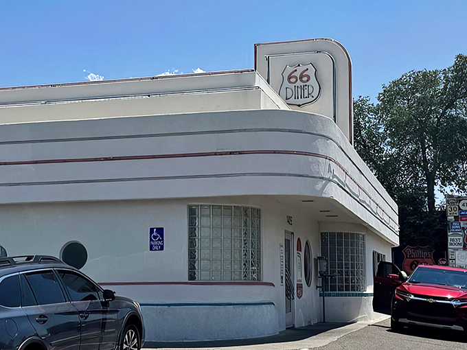Classic curves and gleaming white walls – this Route 66 diner is architectural time travel with a side of nostalgia.