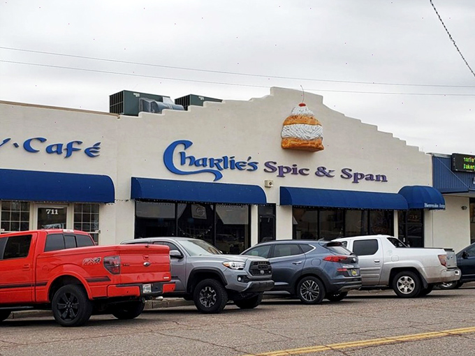 Charlie's Spic & Span beckons with that giant cinnamon roll sign – nature's way of saying "Diet tomorrow, indulge today!"