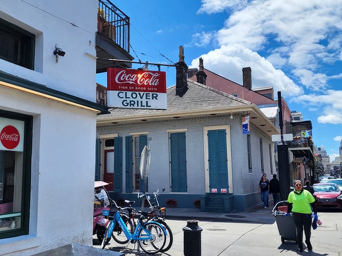The Clover Grill's vintage sign promises "WORLD'S BEST HAMBURGERS" – a bold claim that generations of satisfied diners might just back up.