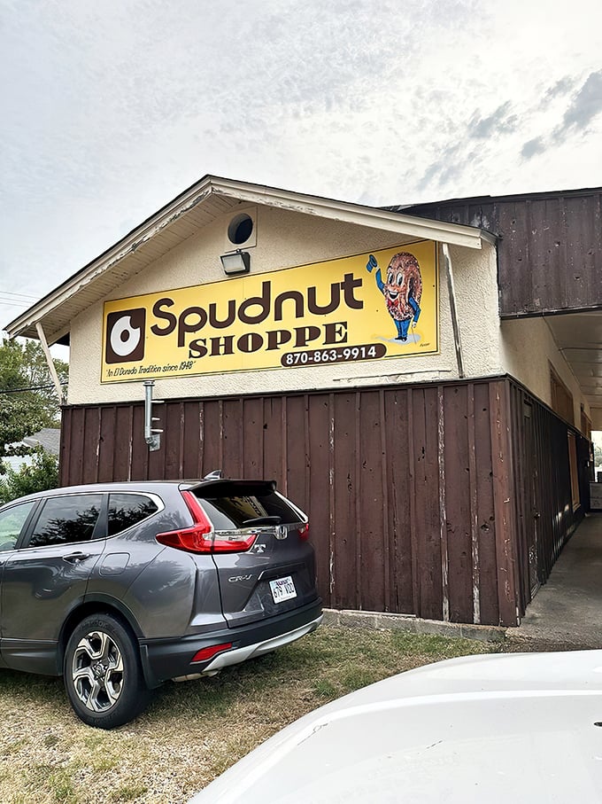 Spudnut Shoppe's vintage yellow sign stands proud – a beacon of potato-flour perfection that's been drawing donut pilgrims for generations.