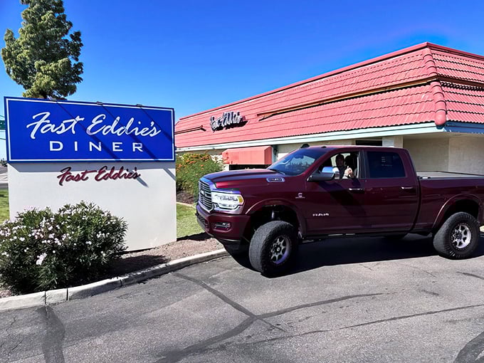 This isn't just a diner—it's a time capsule with milkshakes. Fast Eddie's sign promises speed, but you'll want to linger over every delicious bite.