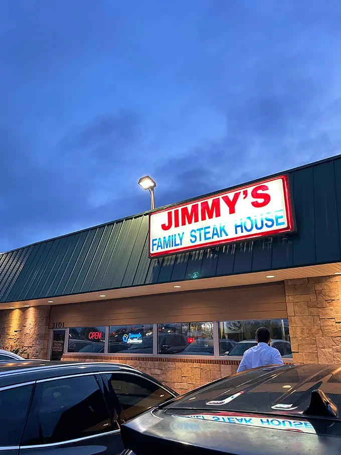 Jimmy's at twilight feels like coming home, even if you've never been before. The sign glows, promising comfort food perfection.