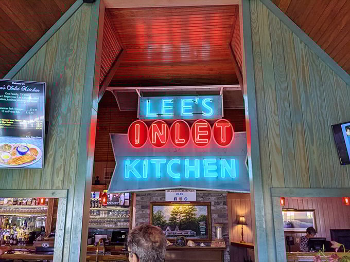 That neon sign isn't just lighting up the room – it's illuminating decades of delicious seafood memories.