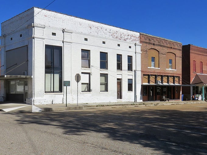 Sunlight catches the classic storefronts of Rector, where shopping local isn't trendy – it's tradition.
