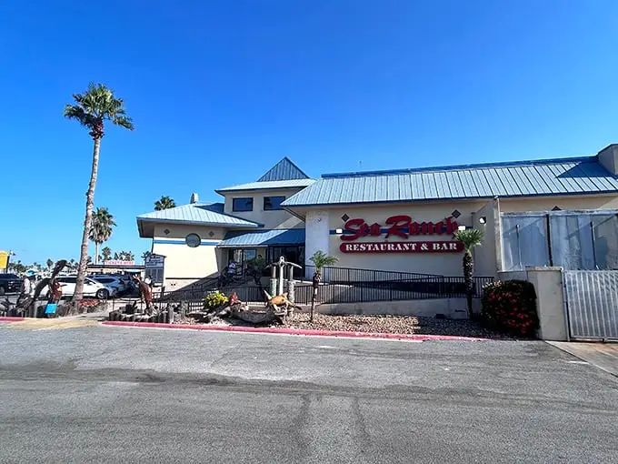 This unassuming beige building with the blue roof houses seafood treasures that would make Neptune himself swim up for dinner.