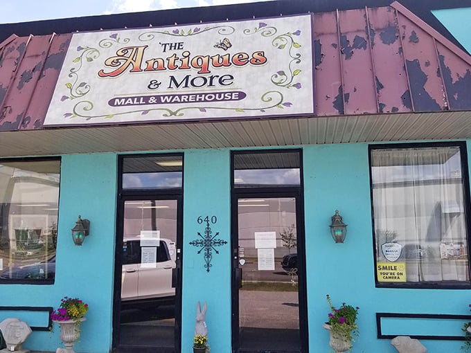 The Antiques & More sign promises exactly what it delivers—a turquoise-fronted wonderland where "more" might be the understatement of the century.
