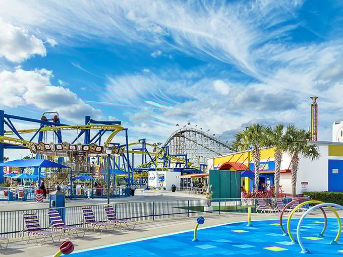 Classic rides and roller coasters paint the skyline against Florida's impossibly blue skies—proof that sometimes the simple pleasures are the most satisfying.