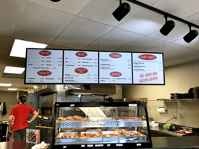 Life's important decisions on display: choosing between salt, cinnamon sugar, or going rogue with a specialty pretzel. The menu board of dreams.