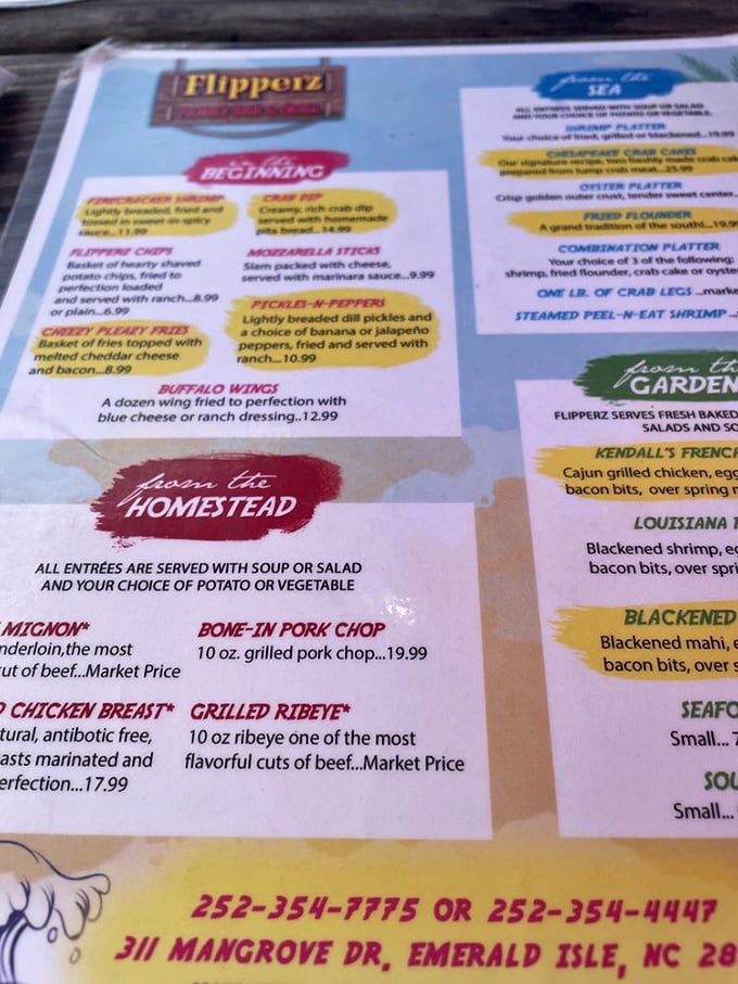A menu that reads like a love letter to seafood lovers. Notice those "Flipperz Chips"? They're about to change your potato expectations forever.