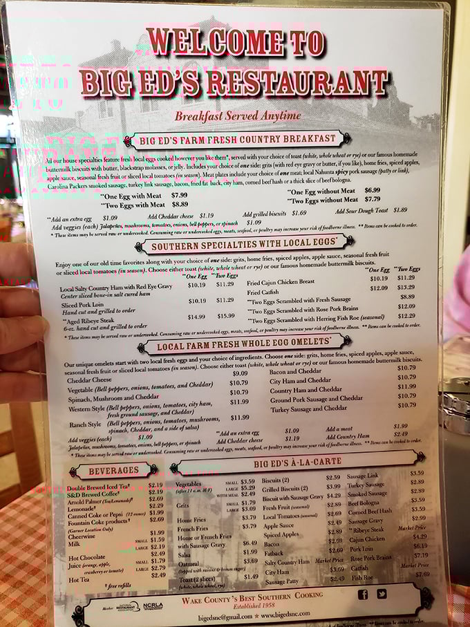 The menu reads like a love letter to Southern breakfast traditions—farm-fresh eggs, country ham, and those famous biscuits that have fueled Raleigh mornings since 1958.