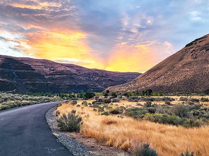 Nature's light show at dusk transforms the canyon into a painter's palette of pinks and golds—no filter needed for this Oregon magic.