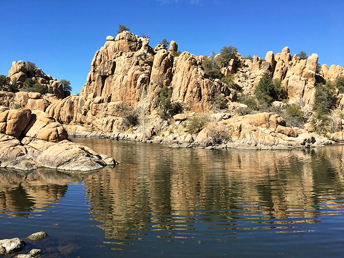 The dramatic granite formations of Watson Lake create nature's own art installation, reflecting on waters so clear they qualify as mirrors-in-training.