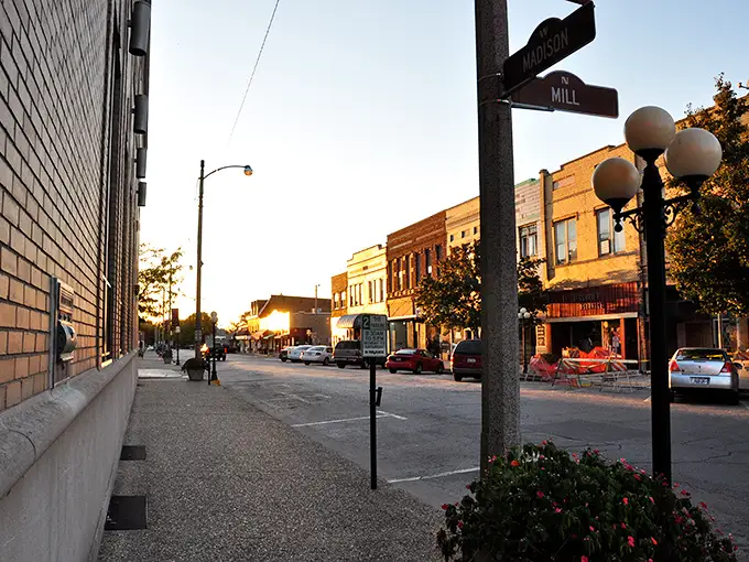 Madison Street at sunset offers that golden-hour magic when even parking meters look poetic and the evening's biggest decision is which local restaurant deserves your appetite.