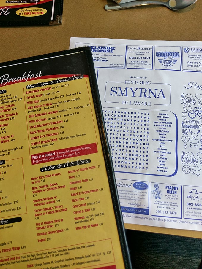 A menu that reads like comfort food poetry—where breakfast is served all day because pancakes know no clock.
