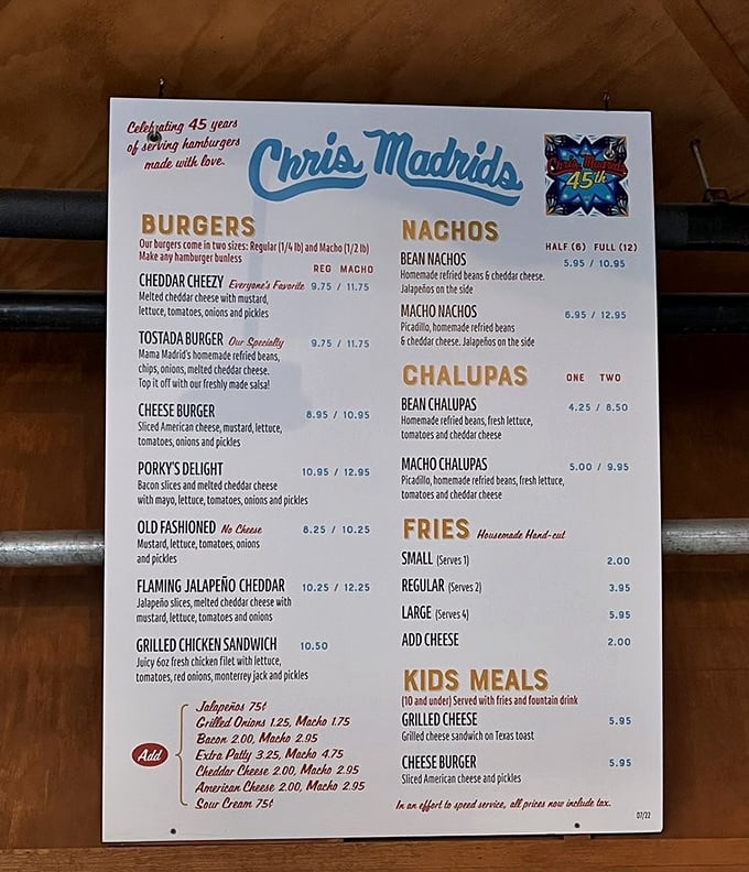 The menu tells the story: over 45 years of burger craftsmanship with that legendary Tostada Burger stealing the spotlight.