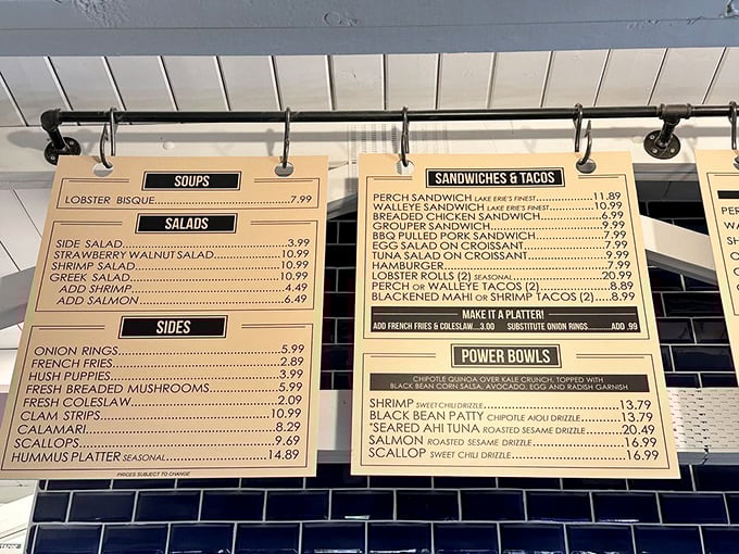 The menu board at Jolly Roger—a maritime treasure map where X marks the spot for perch sandwiches. No fancy descriptions needed when the food speaks this loudly.