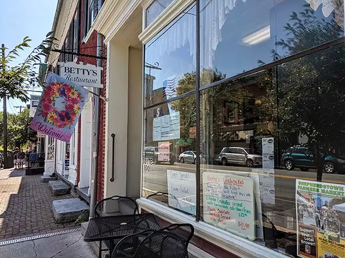 Betty's Restaurant's charming storefront is a portal to simpler times. That welcome flag isn't just decoration—it's a breakfast battle standard!