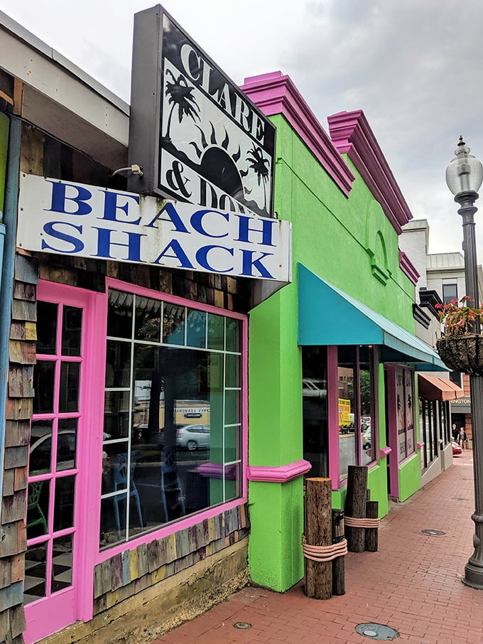 This eye-popping green and pink beach shack stands out like a flamingo at a penguin party. Florida called—it wants its colors back!