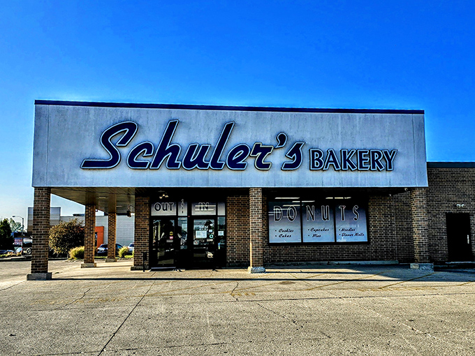 Under clear blue Ohio skies, Schuler's Bakery stands ready to fulfill its sugary destiny. The "IN/OUT" signs are merely a formality.