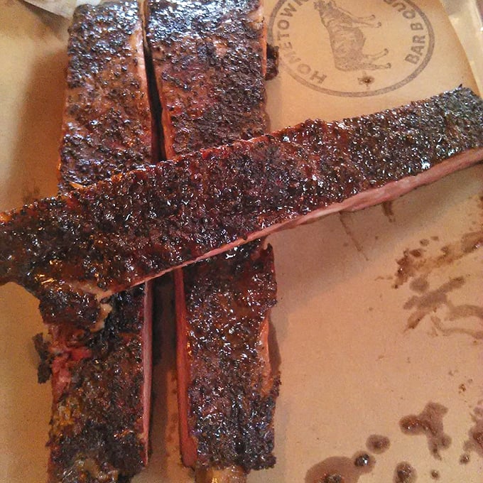 These ribs don't just fall off the bone—they practically leap into your mouth with a perfect bark that's the barbecue equivalent of a Prada suit.