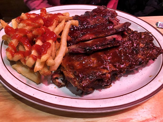 These ribs don't just fall off the bone—they practically leap into your mouth, leaving behind a trail of sticky, sweet-spicy sauce that demands to be licked from fingers.