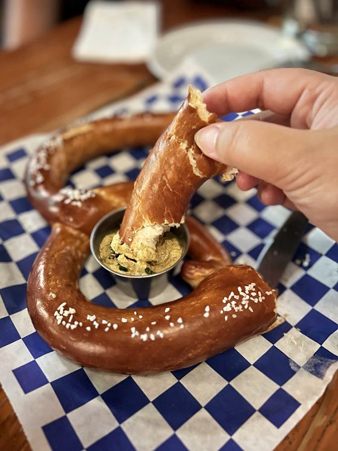 That perfect pretzel tear reveals a pillowy interior that would make any Bavarian baker proud. The mustard awaits its moment of glory.
