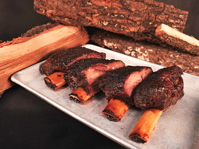 These beef ribs aren't just dinner—they're prehistoric monuments to smoke and patience, with a bark so perfect it deserves its own appreciation society.