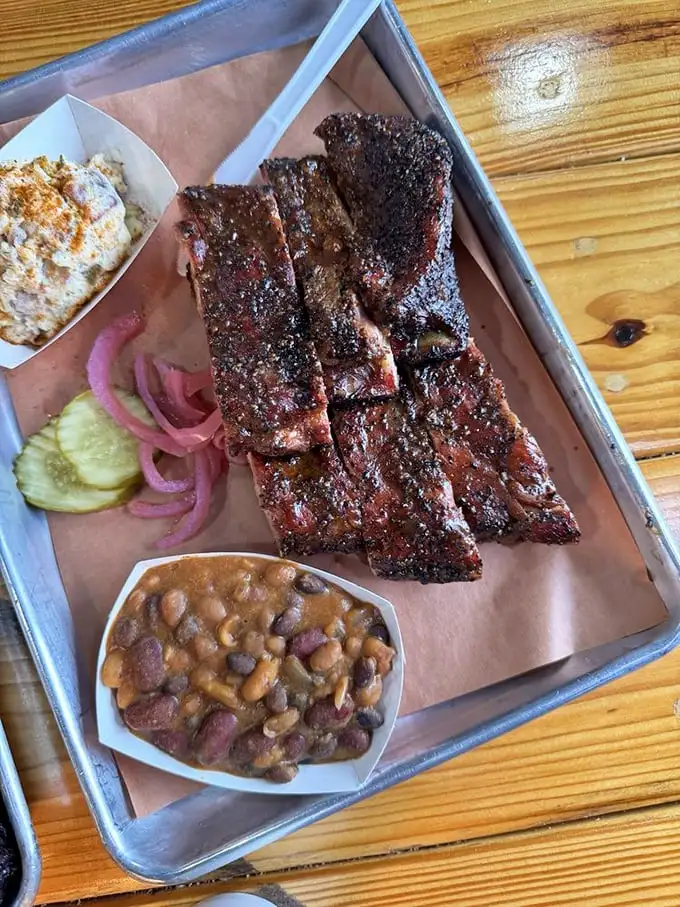 These ribs don't just have a smoke ring—they have a smoke halo, with perfectly rendered fat and a peppery bark that's worth crossing state lines for.