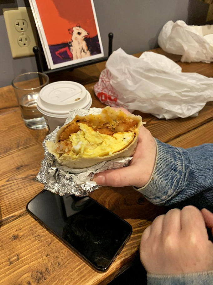 Breakfast burritos should be judged by their cross-section. This one passes with flying colors—literally. The foil wrapper is just trying to contain the excitement.