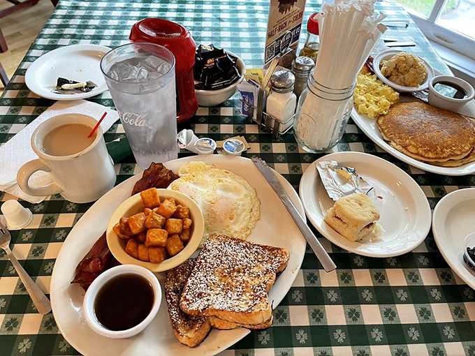 Breakfast nirvana achieved: golden French toast, perfectly cooked eggs, and home fries that make you question why you ever eat anything else.