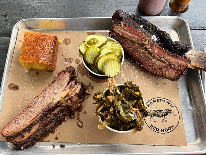 Meat paradise found! This tray showcases the holy trinity of barbecue—brisket with that perfect smoke ring, sausage with snap, and ribs that surrender at first bite.