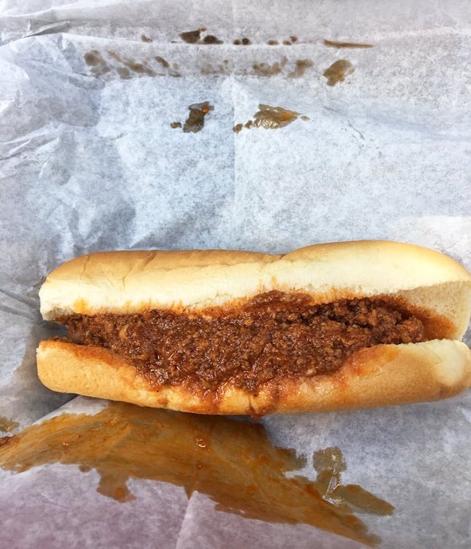 Chili dog perfection in its natural habitat. This isn't just lunch—it's a savory symphony on a soft bun that makes fast food chains weep with envy.