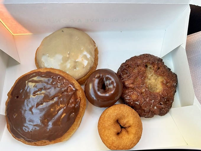 Behold the dream team of breakfast indulgence. That apple fritter on the right isn't just a donut—it's architecture, sculpture, and pure joy.