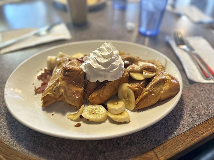 French toast that's had a rendezvous with caramel, whipped cream, and bananas. Breakfast? Dessert? The line blurs deliciously here.