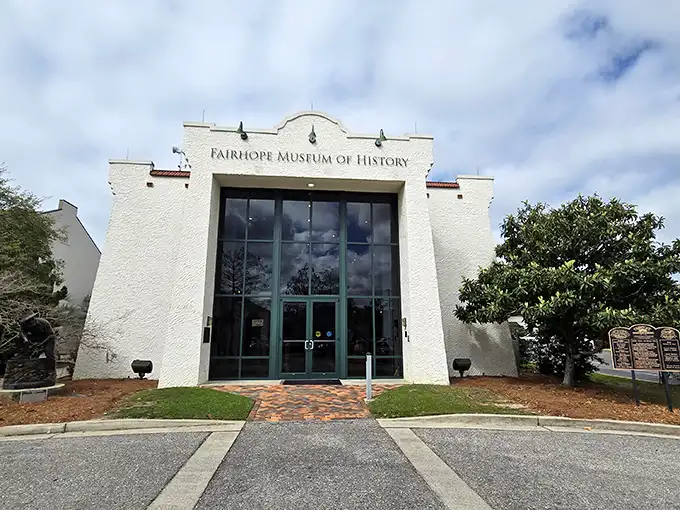 The Fairhope Museum of History's Spanish mission-style façade houses treasures that tell tales of idealists who believed utopia wasn't just possible—it was buildable.
