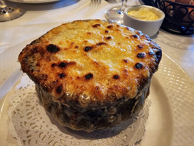 Behold, the holy grail of comfort food—French onion soup with a crown of golden, bubbling Gruyère that stretches with each spoonful like a cheese lover's dream.
