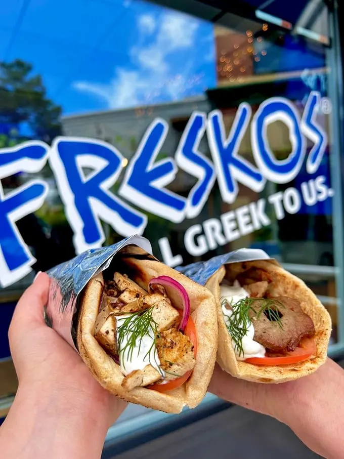 Two perfect handheld happiness machines, wrapped in foil and ready for their Instagram moment. These gyros aren't just photogenic – they're life-changing.