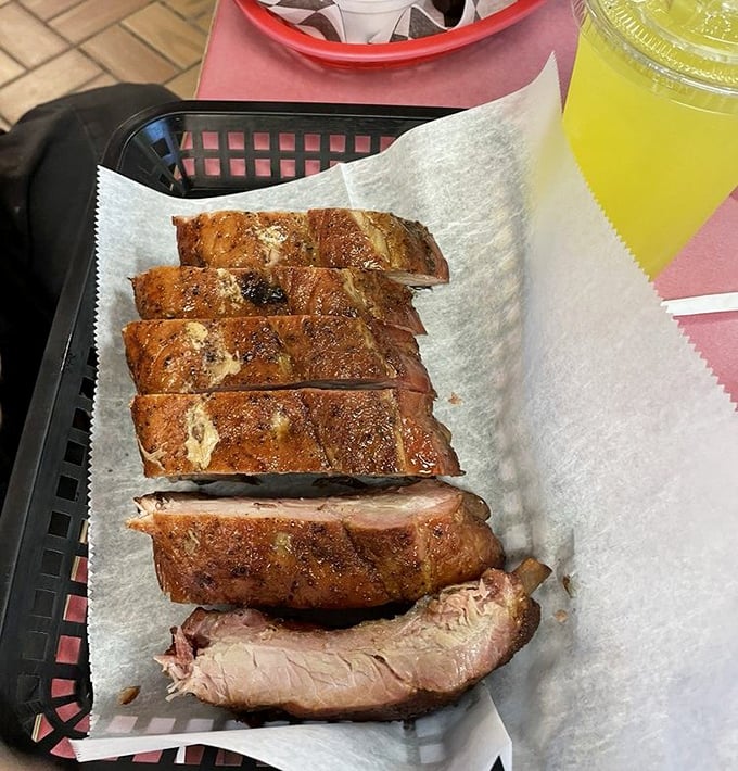 Behold the half rack of ribs in all their glory! That bark, that smoke ring, that juicy meat—this is what barbecue dreams are made of.