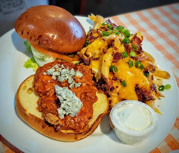 This isn't just a sandwich; it's an architectural marvel of crispy chicken, melty cheese, and loaded fries that makes calorie counting seem like buzzkill math.