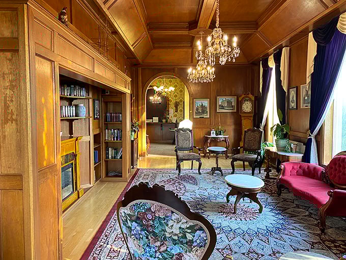 The wood-paneled library screams "old money" in the best possible way. Agatha Christie would approve of this perfect spot for both reading and dramatic revelations.