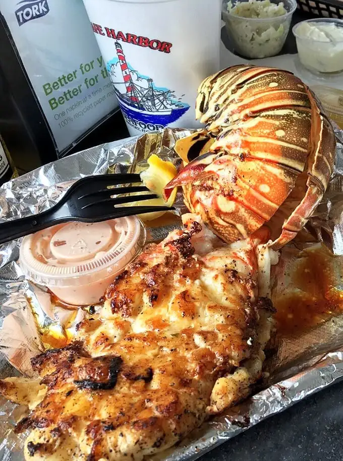 This isn't just a lobster tail—it's the grand finale of an ocean symphony. Perfectly grilled and ready for its butter bath.