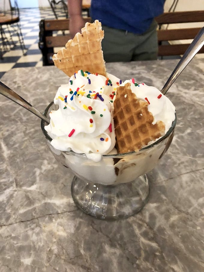 This isn't just vanilla ice cream—it's a celebration with sprinkles and waffle triangles standing at attention like party flags.
