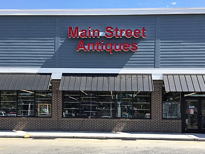 Main Street Antiques announces itself boldly against the sky – a siren call to collectors and the simply curious alike.