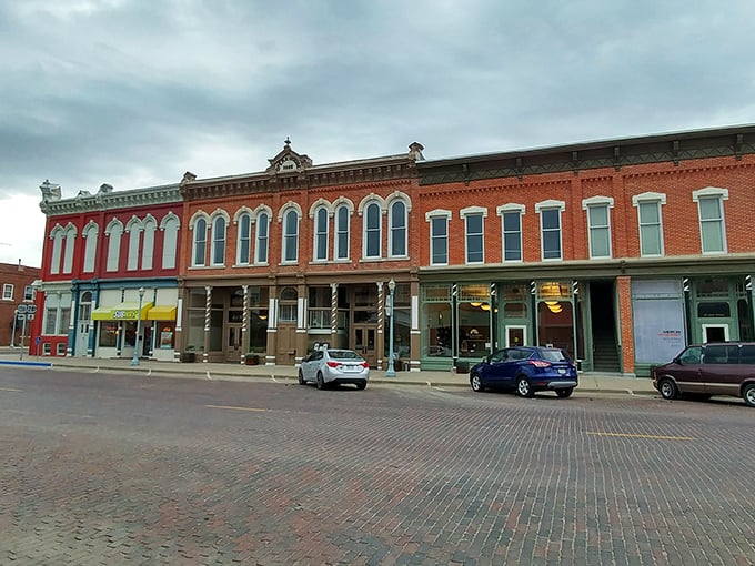 These historic storefronts along Webster Street haven't changed much since Cather's day—like stepping into a sepia photograph that's suddenly gained color.