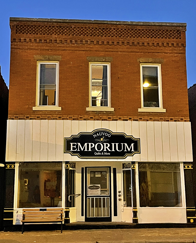 The Nauvoo Emporium promises "Quilts & More," and who among us hasn't been lured in by the promise of "& More"? Brick buildings and wooden benches—classic Americana. 