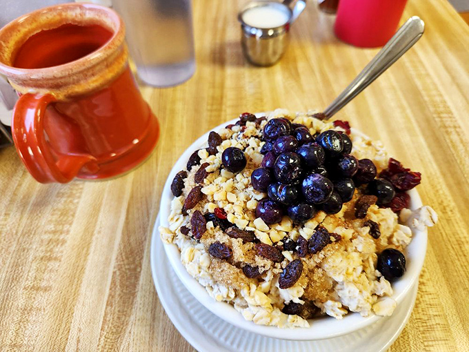 A mountain of oatmeal that doesn't know it's supposed to be boring. Fresh blueberries and what appears to be granola transform this humble breakfast into something worth getting out of bed for.